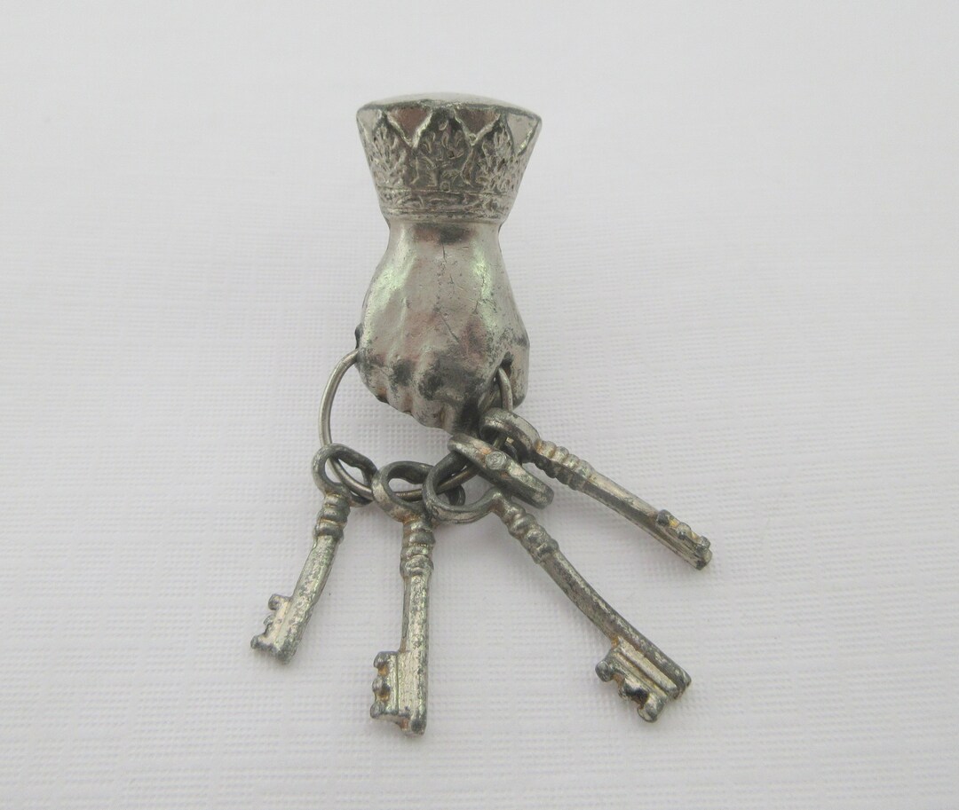 Deja reja Silver Tone Hand Holding Dangle Keys Fur Clip - Etsy