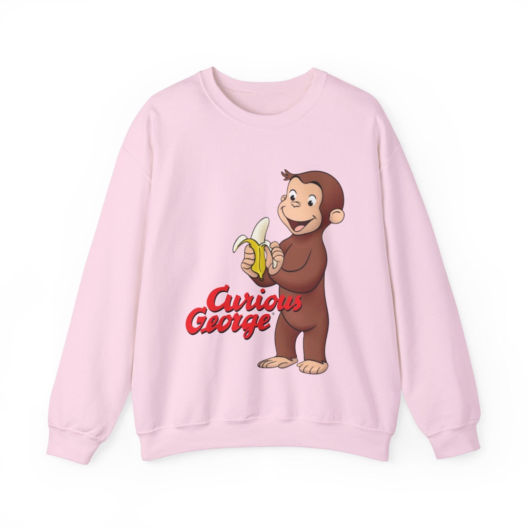 Curious George Peeling a Banana Modern Cartoon With Logo Unisex Heavy ...