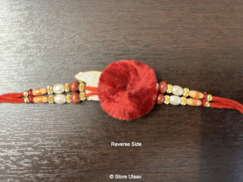 Traditional Rakhi Paisley Maroon Silk Tuft Base With Floral Zari Work ...