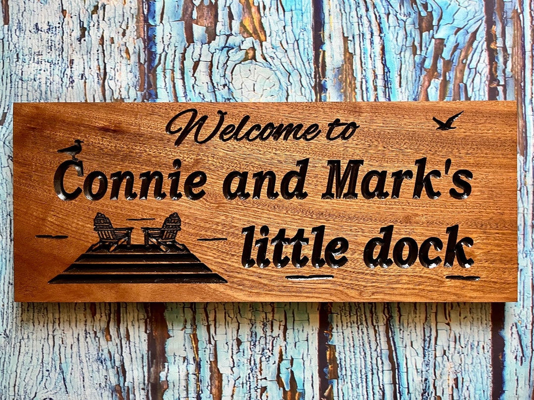 Wooden Carved Welcome Sign With Wood Dock, Adirondack Chairs and Sea ...