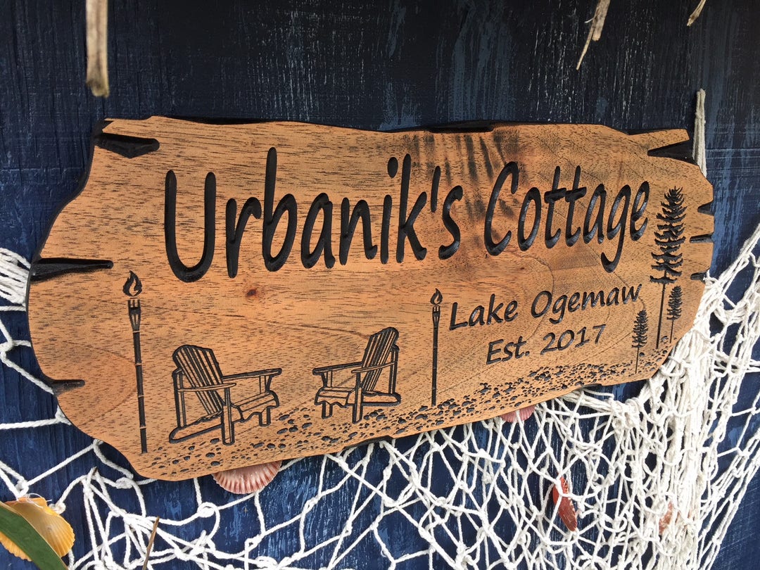 Wooden Carved Outdoor Sign With Tiki Torches and Adirondack Chairs ...