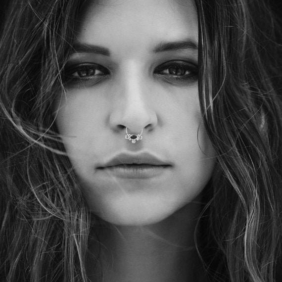 Sexy Caucasian Brunette Woman With A Septum Piercing Wearing A Grey Dress And Silver Jewelry