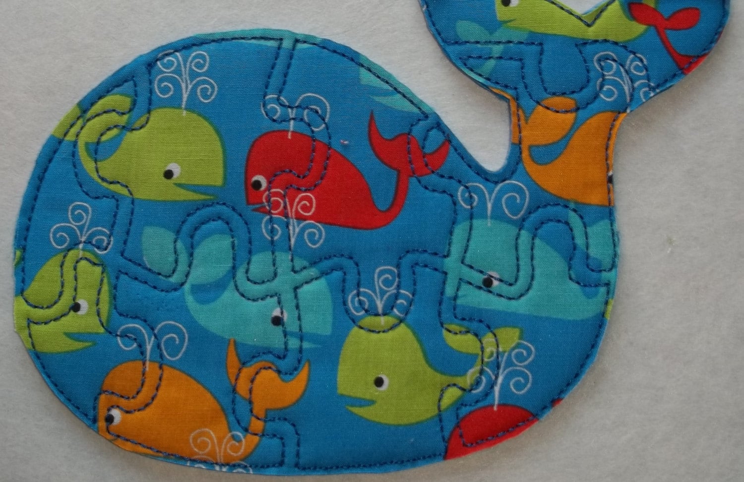 Whale Shaped Puzzle colored whales on solid blue fused to | Etsy