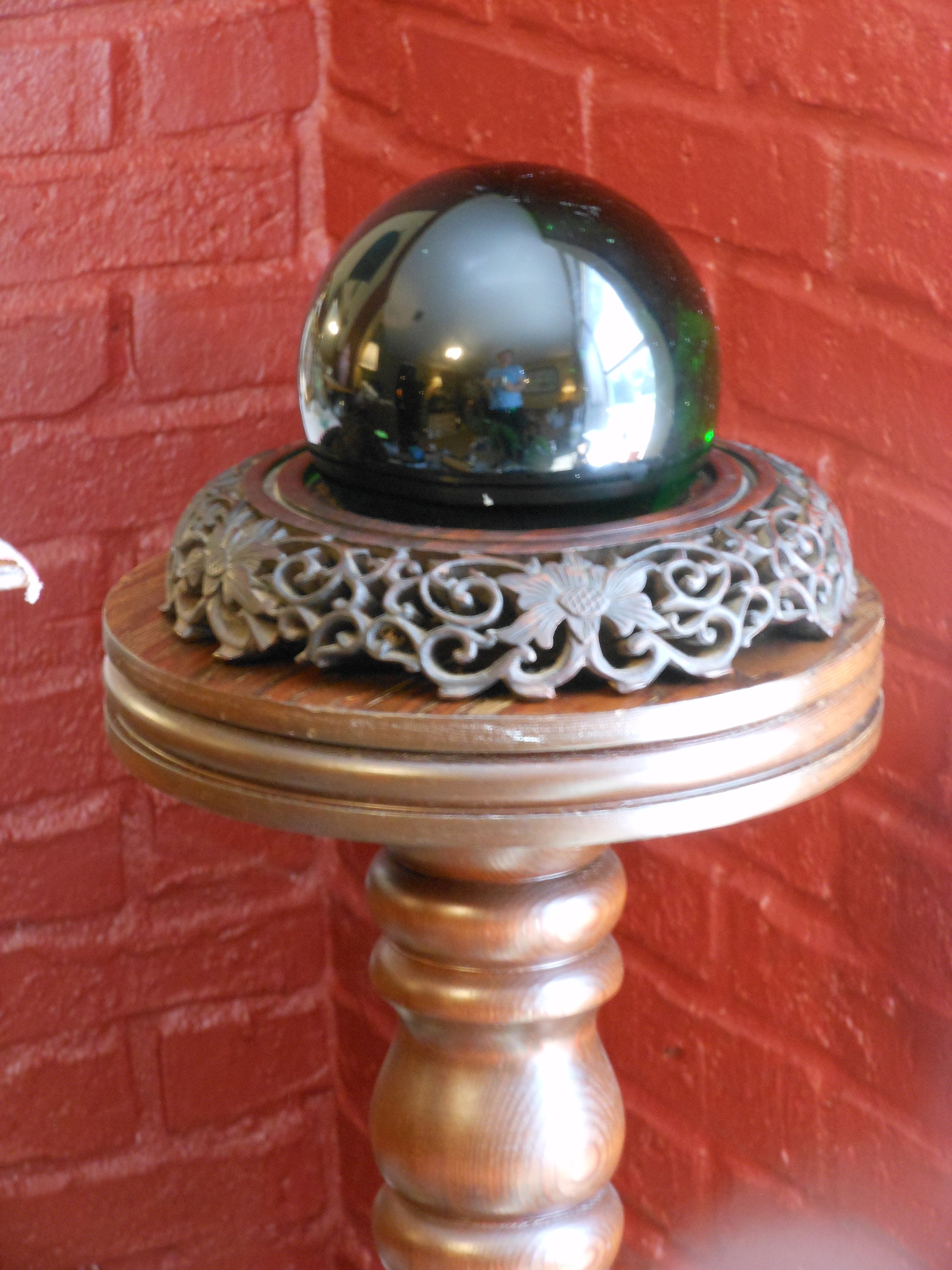 Dark Green Orb on a Wooden Stand