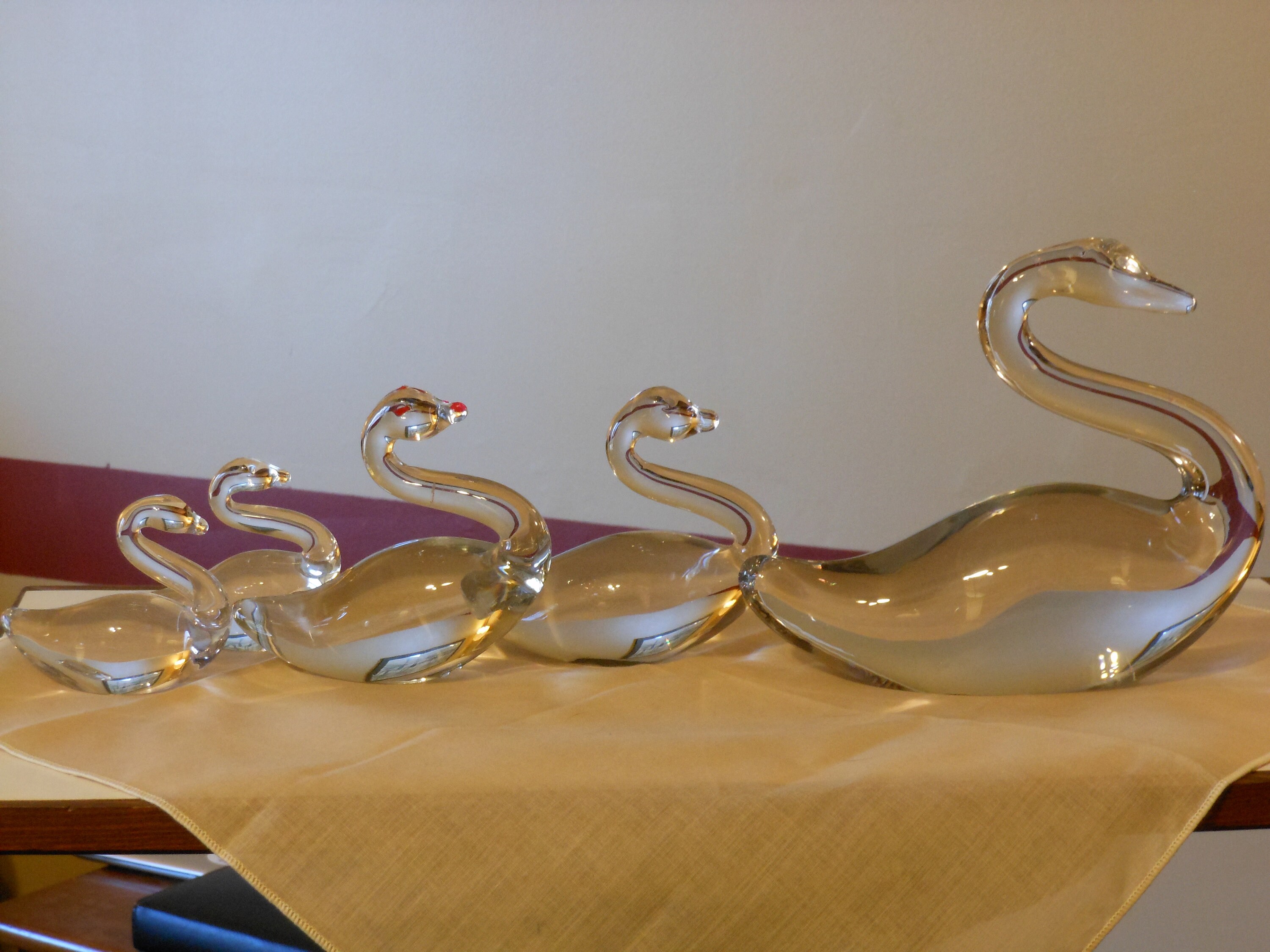 Set Of Five Solid Glass Swans
