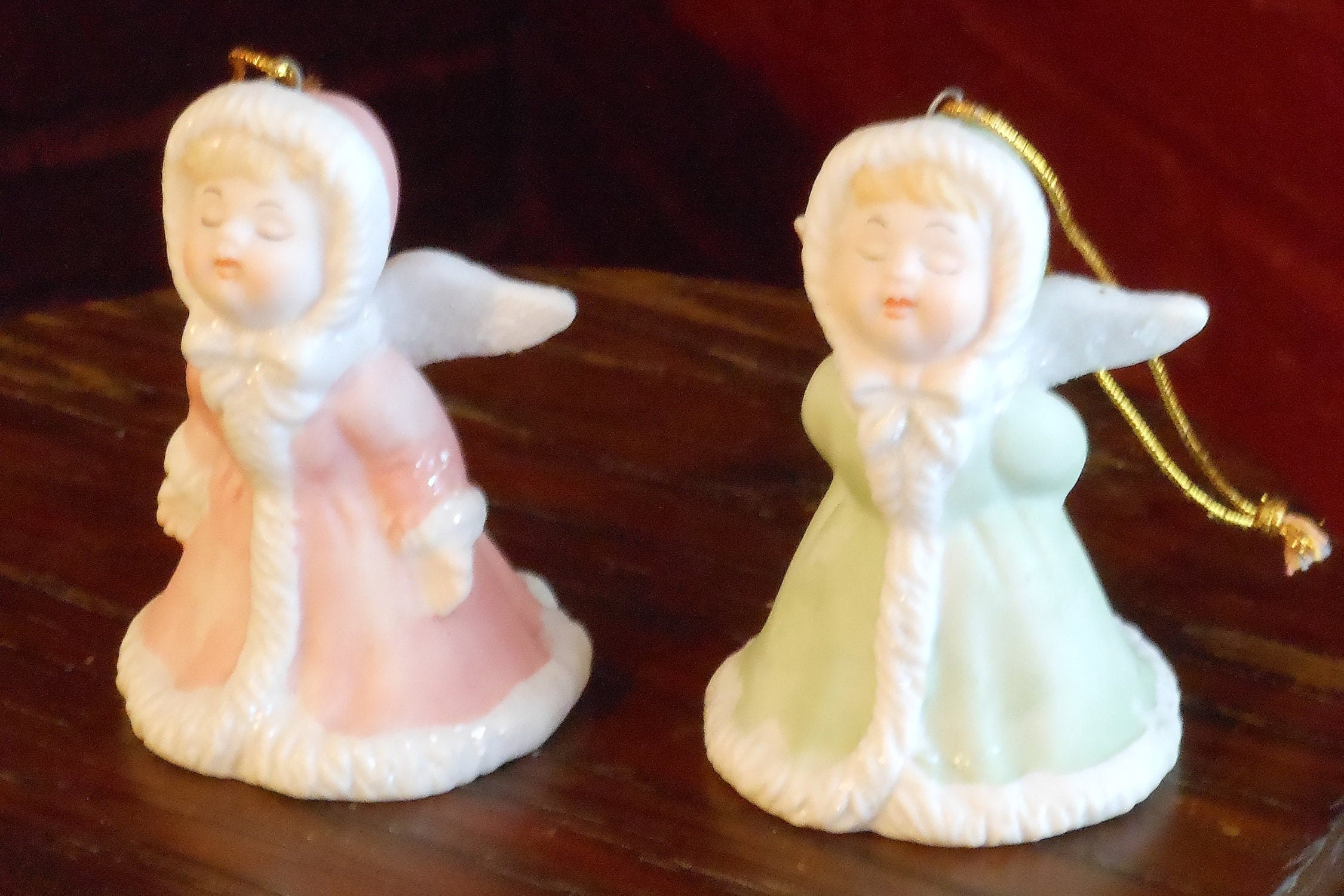 Two Matching Bisque Porcelain Angel Bell Christmas Ornaments