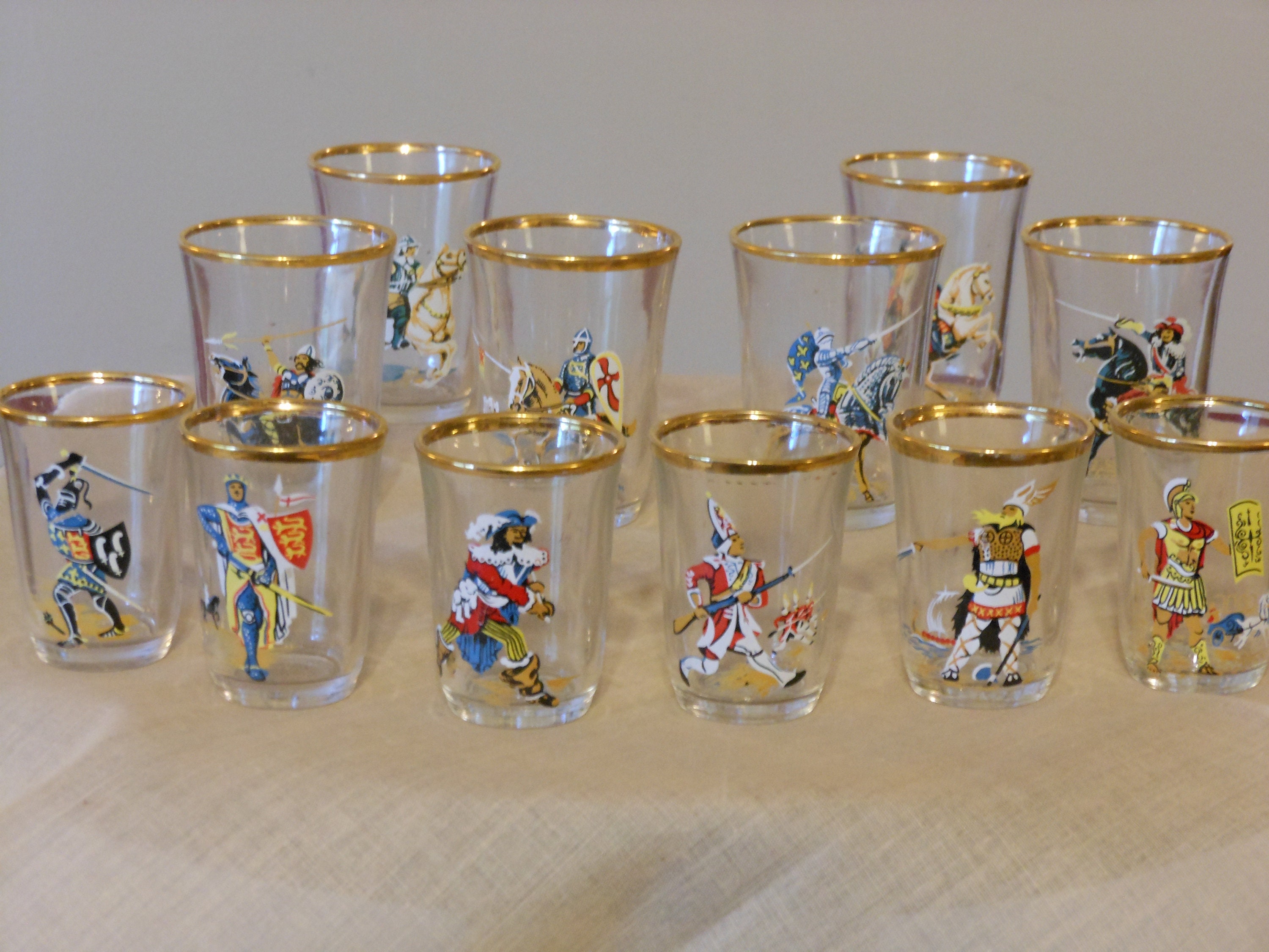 A Dozen Hand Painted English Warrior Shot Glasses