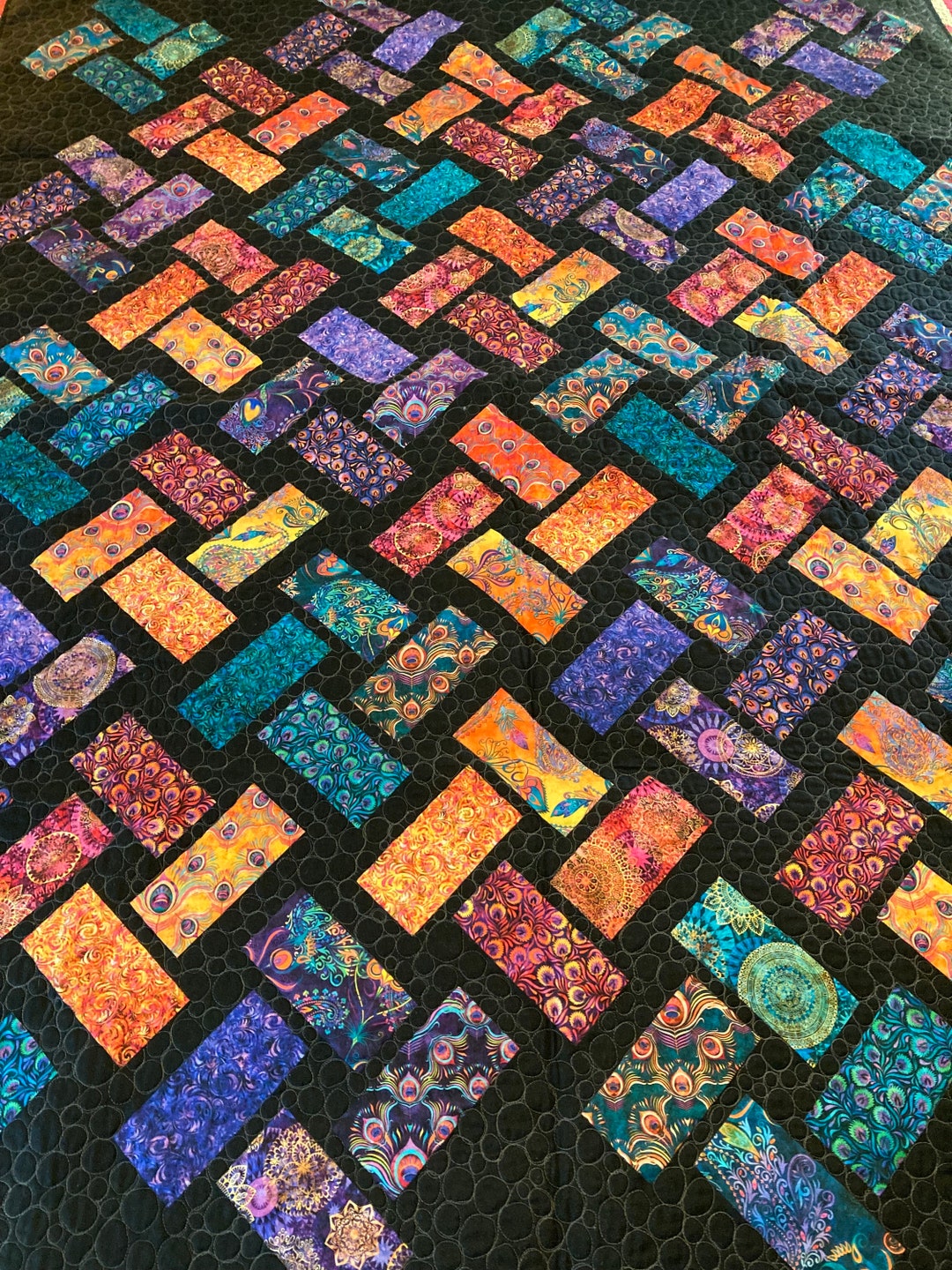 Eclectica Spinning Multi Color Peacock Feathers on Black Background ...