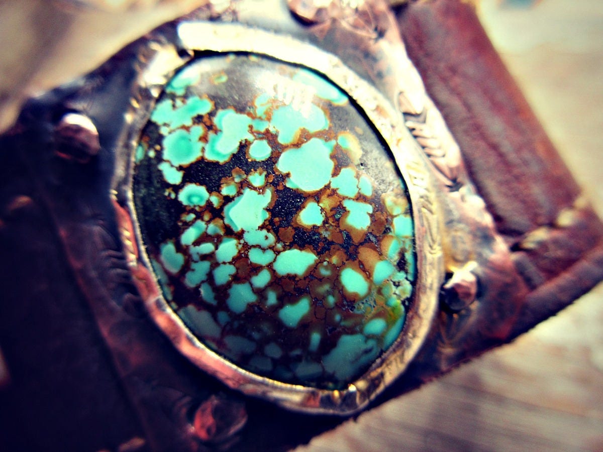 Wild colored matrix turquoise stone set in embossed feather bezel on ...