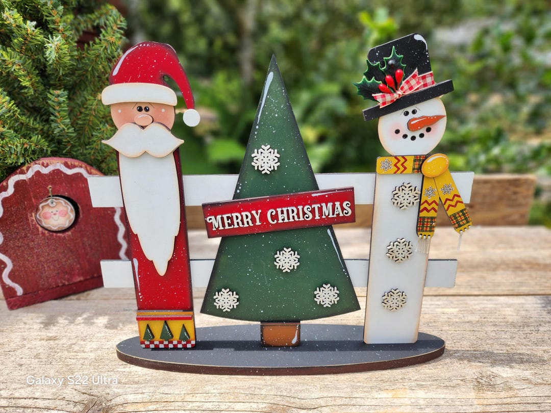 This Laser Cut File is a Christmas Trio Picket Fence Featuring a Santa ...