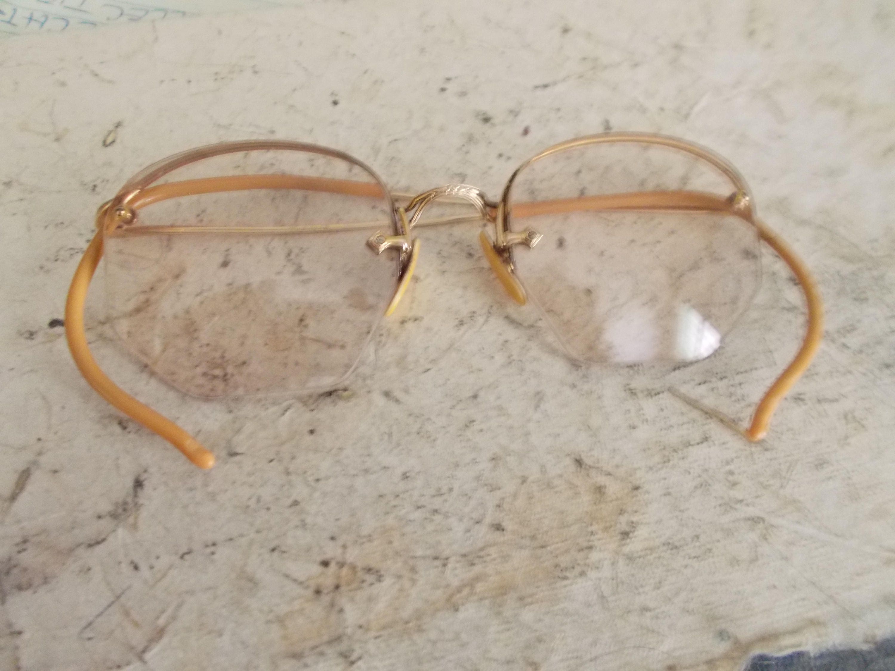 Vintage rimless gold frame eyeglasses, celluloid nose piece, oldies but ...
