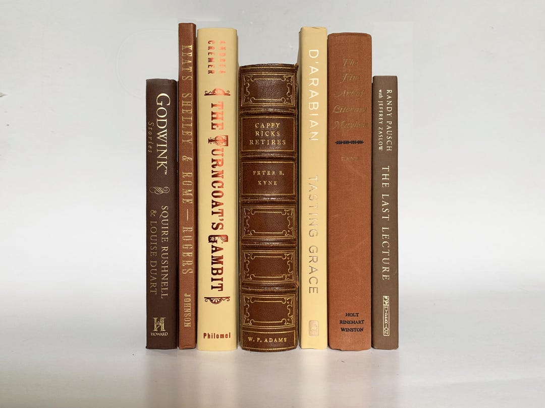 Valuable Stack of Books in Warm Cinnamon Leather and Shimmering Vanilla ...
