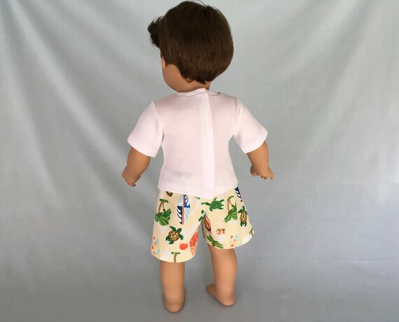 Multiple piece set four pocket shorts with surfboard graphic tee made ...