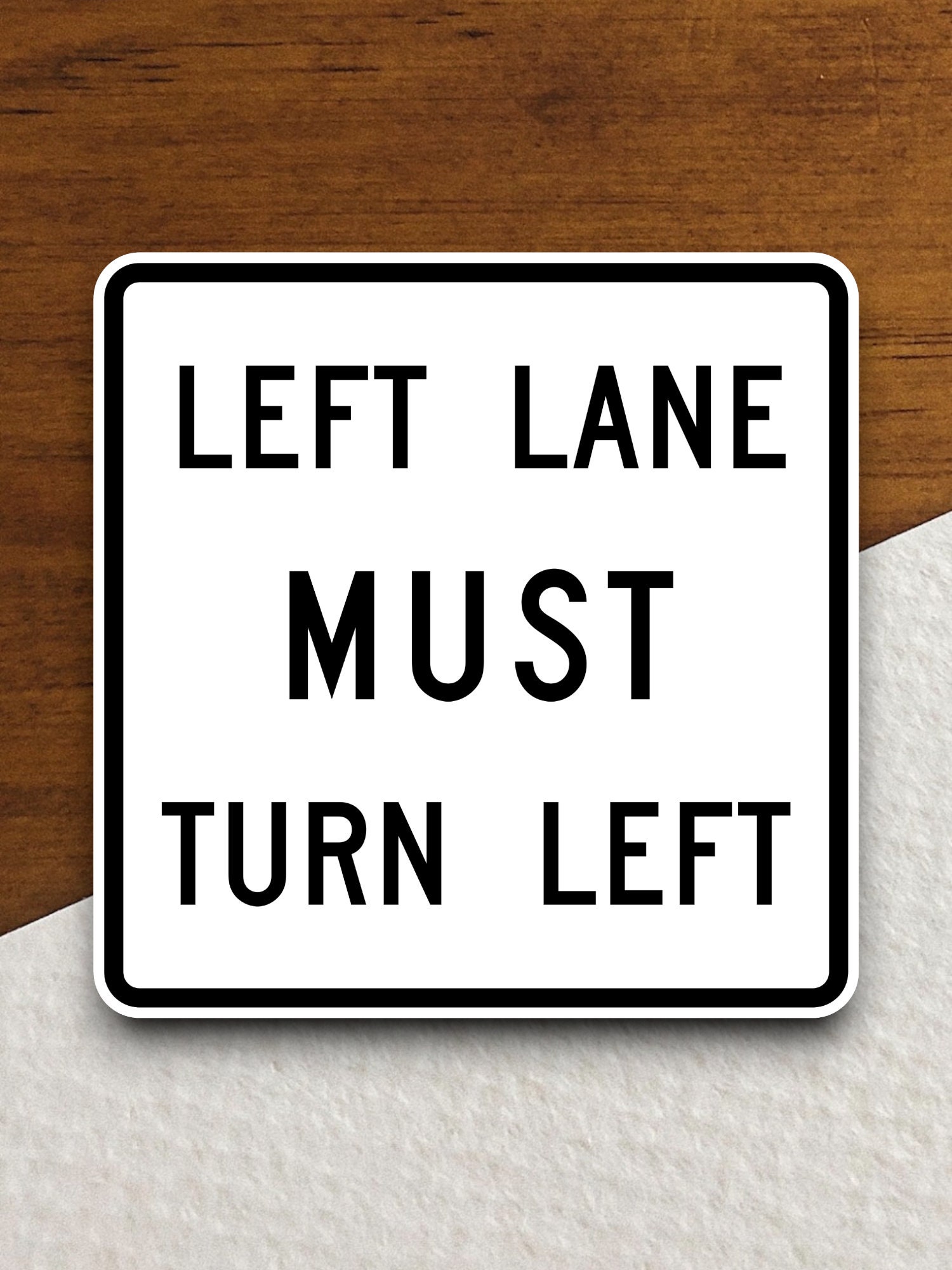 Left Lane Must Turn Left Sign