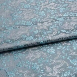 Light Blue Color Brocade Fabric With Chinese Silver Dragon Pattern ...
