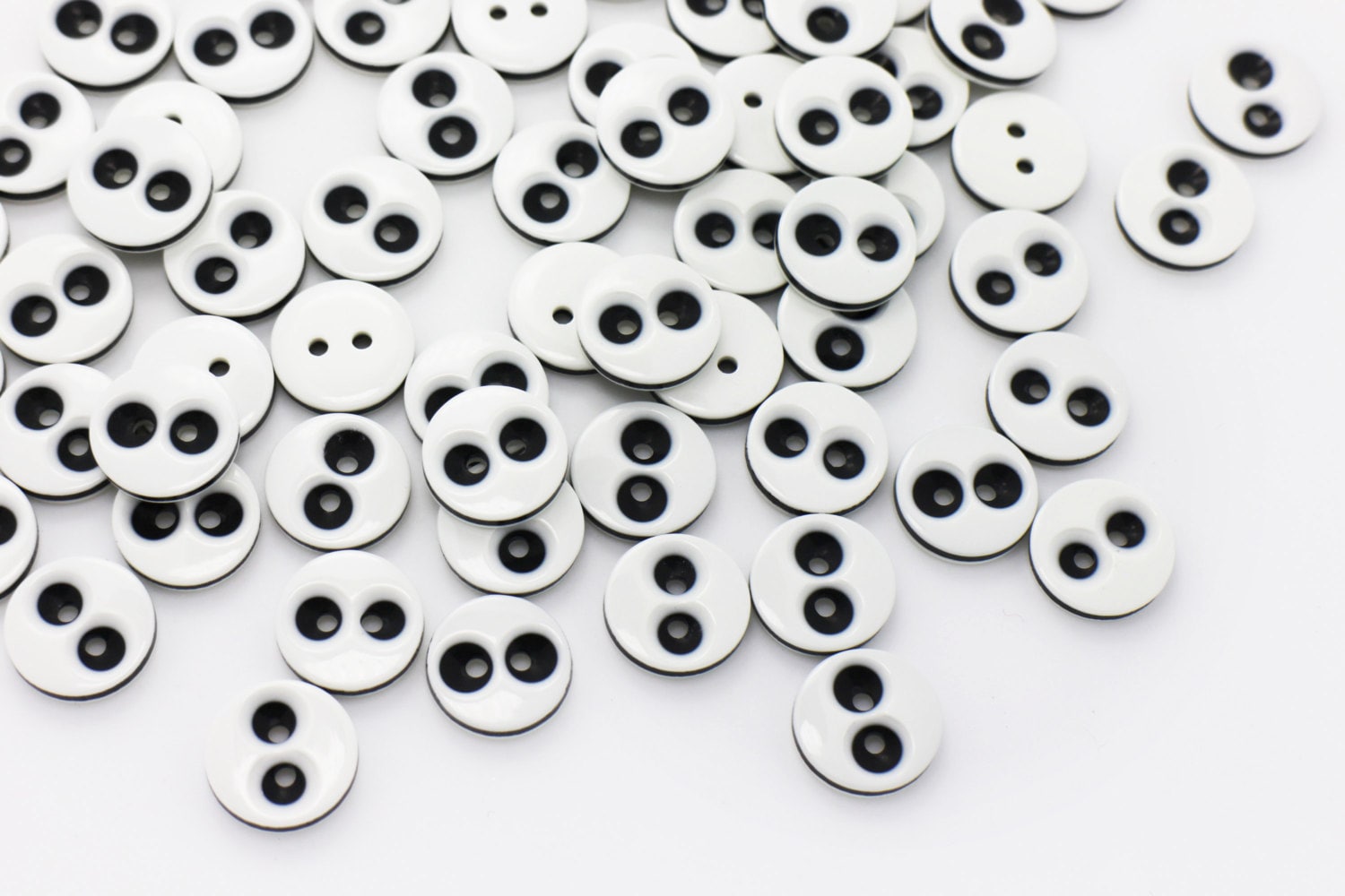 Black Eyes Button, White Background, Made of Resin,, Black and White ...