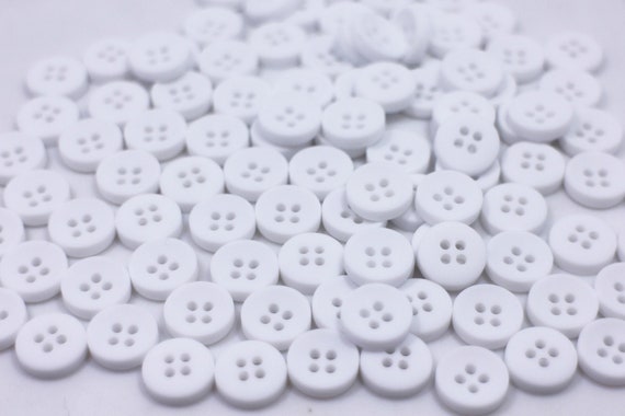 Tiny white buttons store