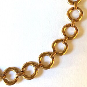 Vintage Set by CORO. Small Gold Tone Metal Hoop Motif Necklace and ...