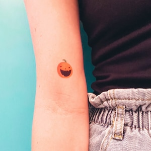 cute tiny pumpkin tattoo