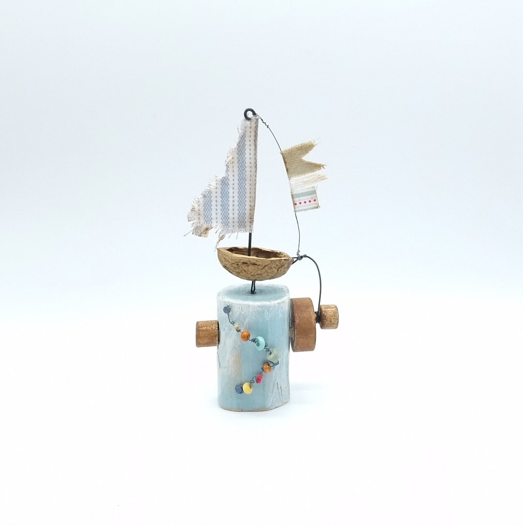 Whimsical Handcrafted Automaton With Moving Walnut Shell Boat. Recycled ...