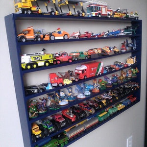 Planes Fire and Rescue, Cars, Monster Trucks, Legos, Wall Display Rack ...