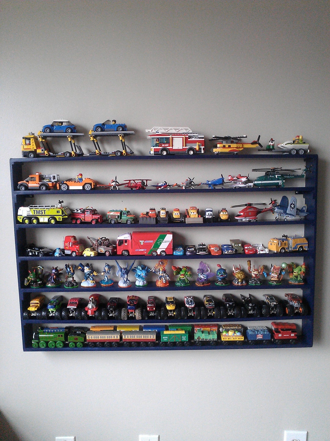 Planes Fire and Rescue, Cars, Monster Trucks, Legos, Wall Display Rack ...