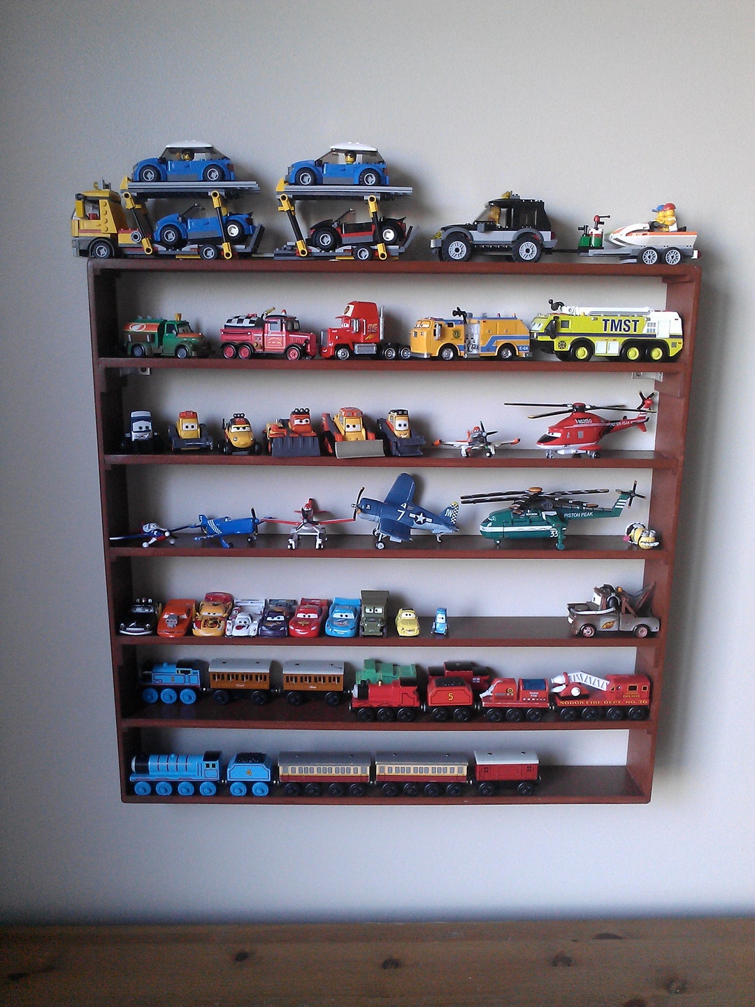 Planes Fire and Rescue, Cars, Monster Trucks, Legos, Wall Display Rack ...