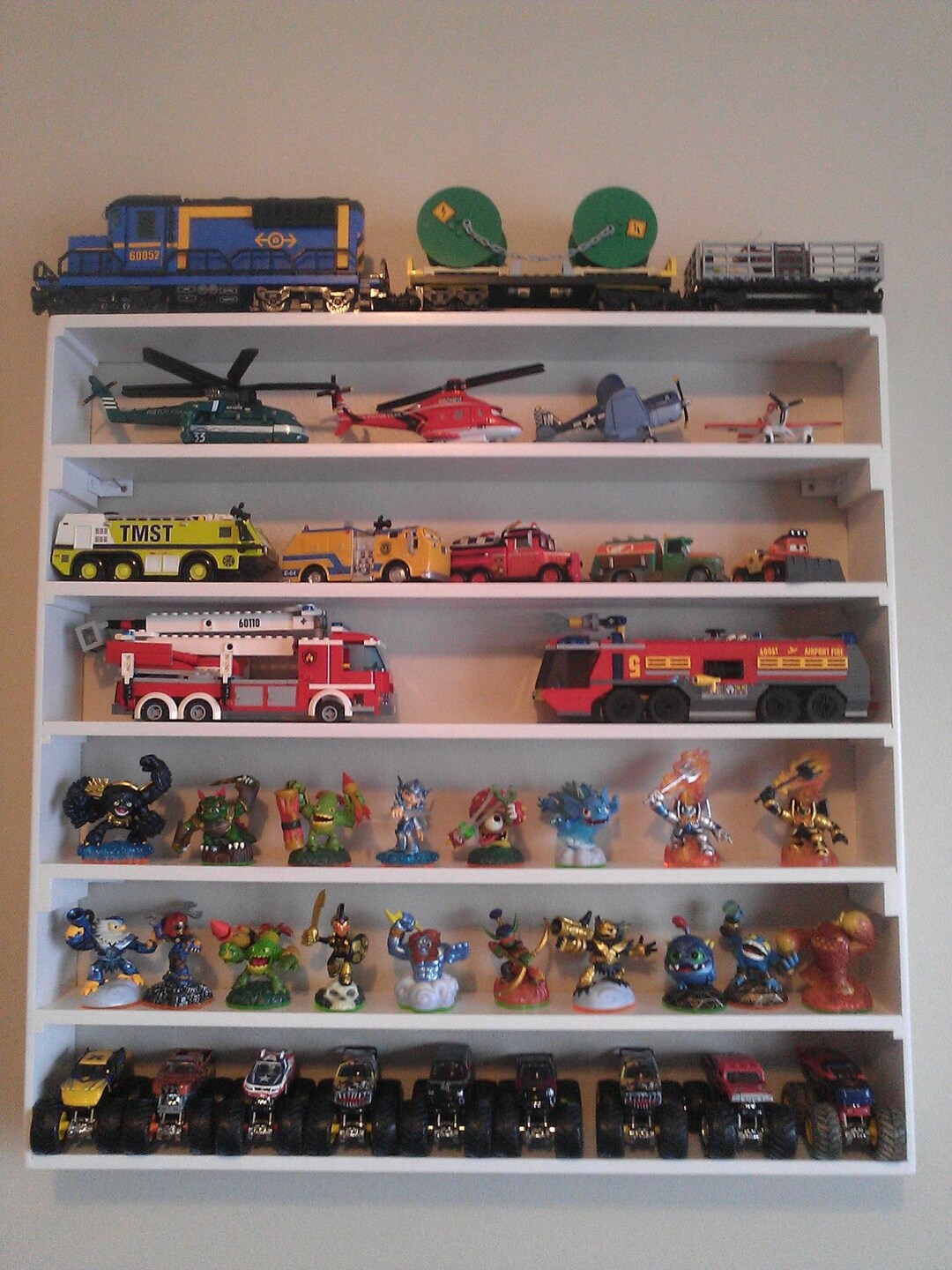 Planes Fire and Rescue, Cars, Monster Trucks, Legos, Wall Display Rack ...