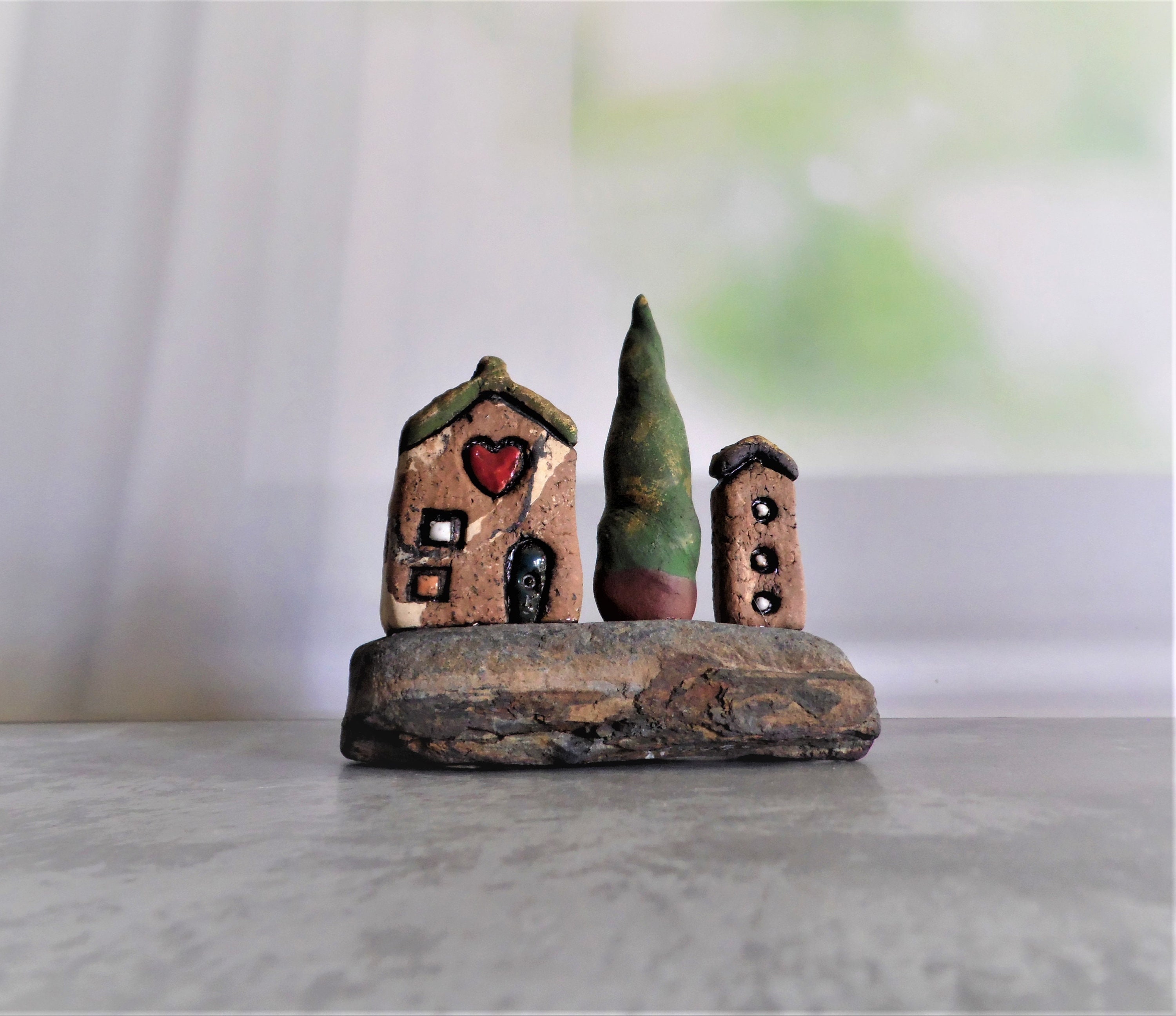 Miniature ceramic village with beach houses and a tree on a | Etsy