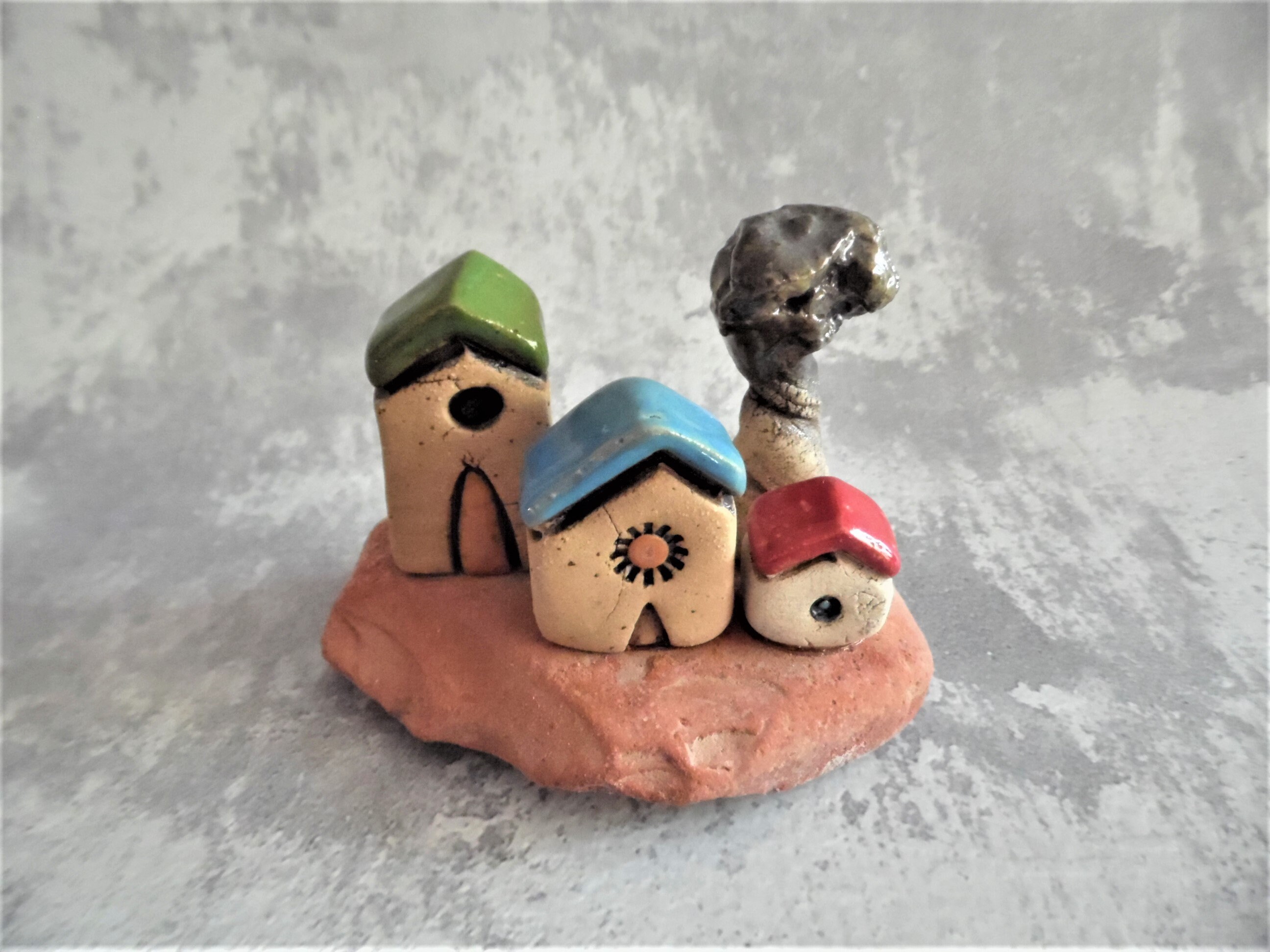 Miniature Ceramic Village With Clay Houses on a Roof Tile Eroded by the ...