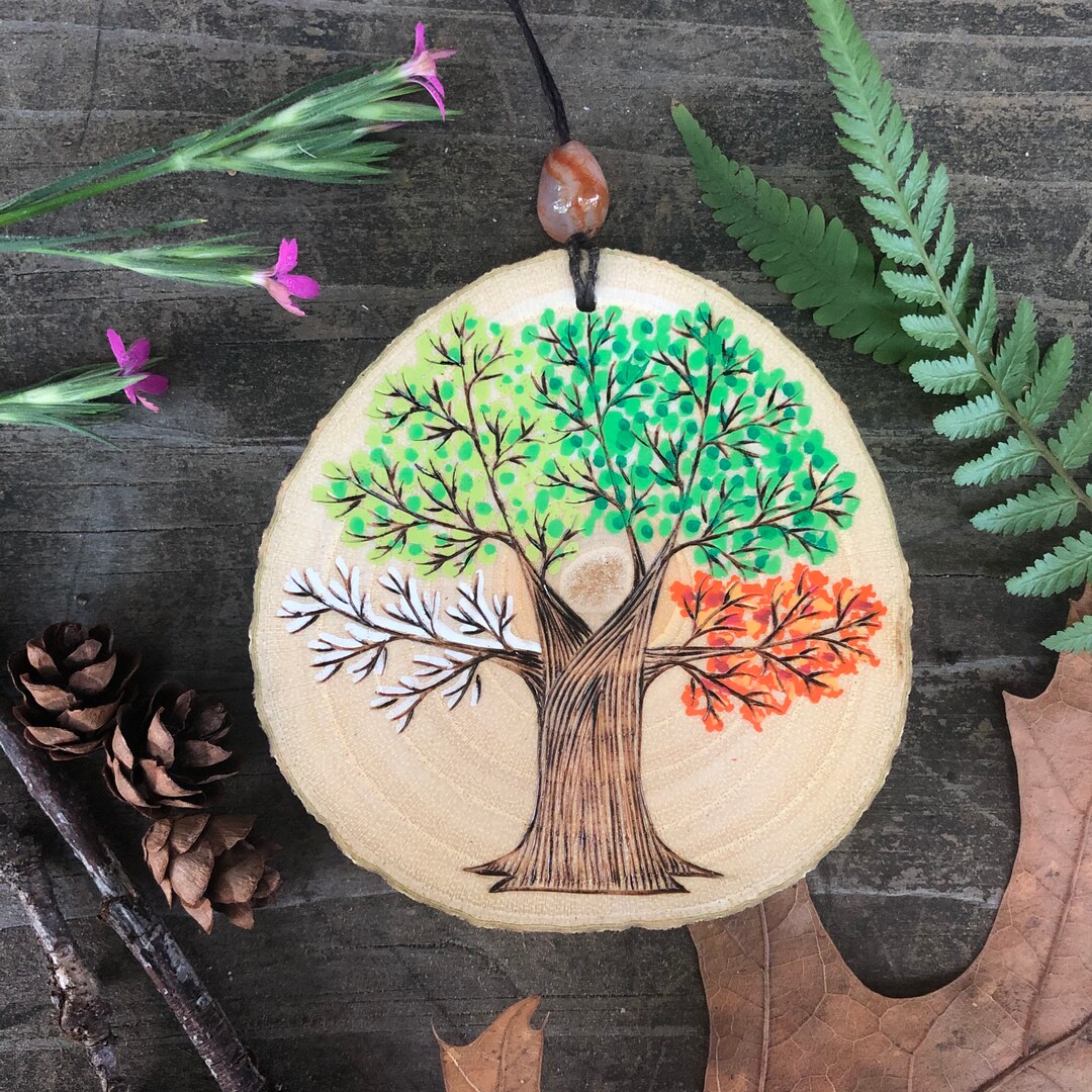 Four Seasons Tree on Wood Slice. Winter, Spring, Summer and Autumn ...