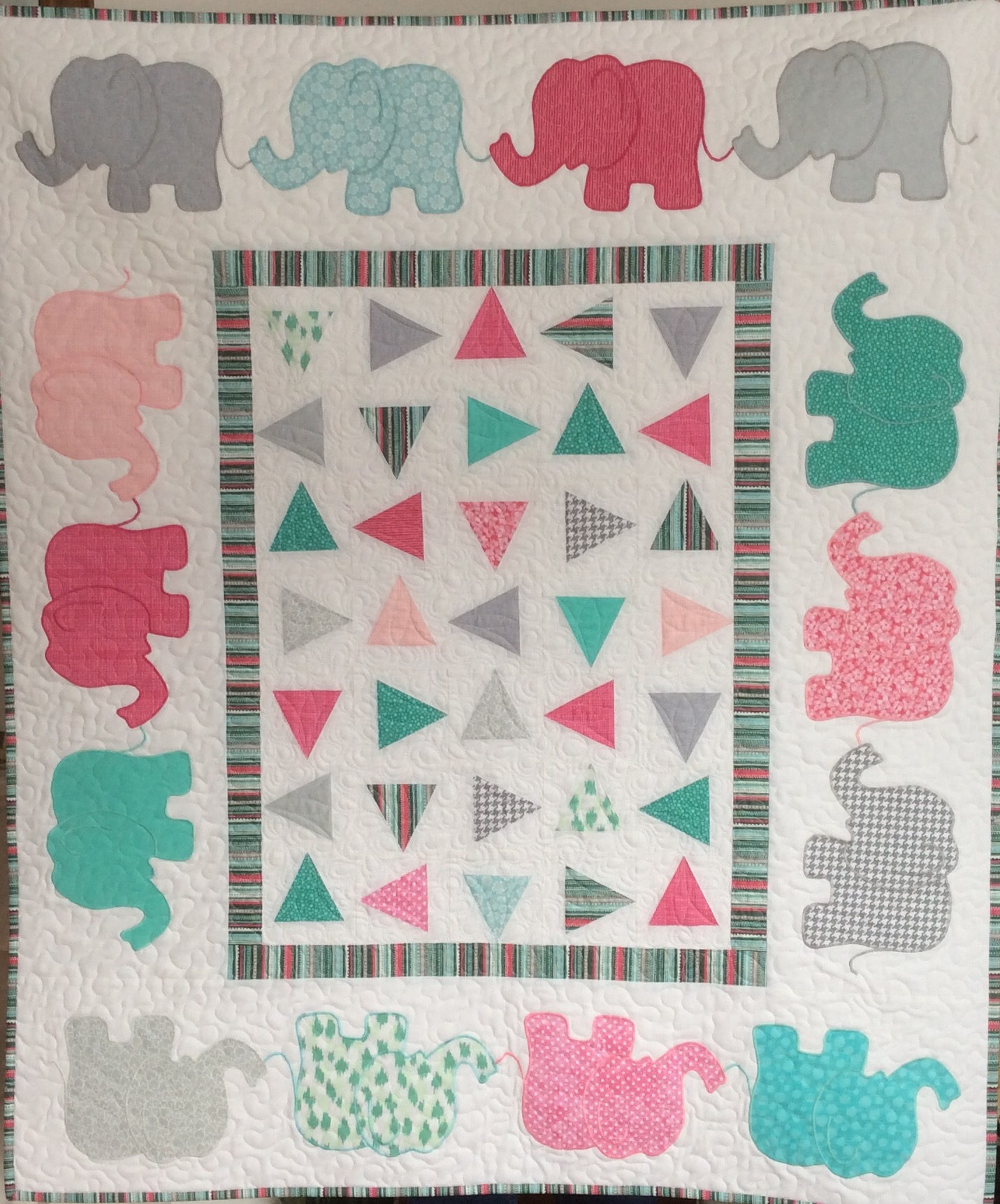 Handmade Parade of elephants baby quilt.