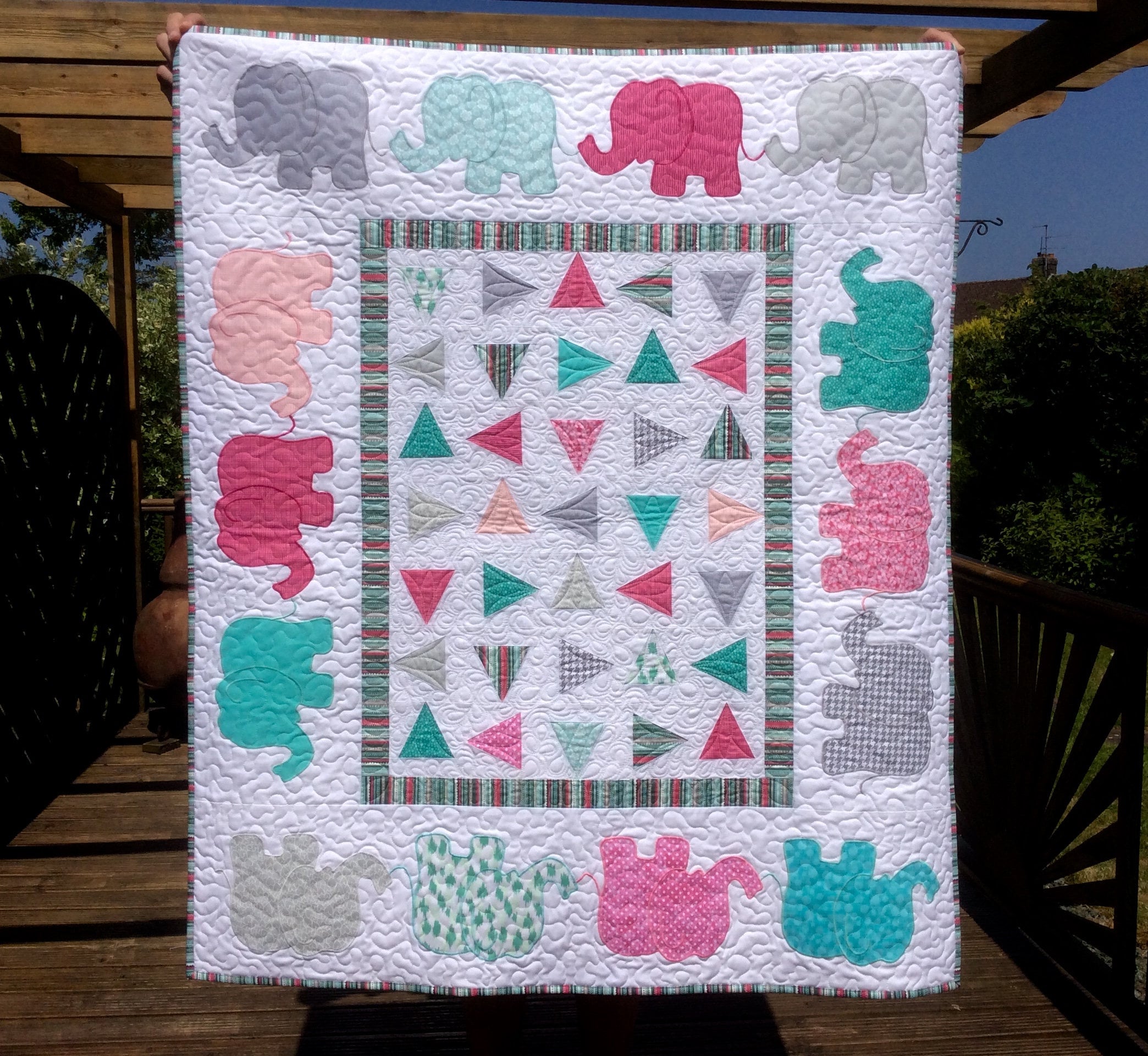 Handmade Parade of elephants baby quilt.