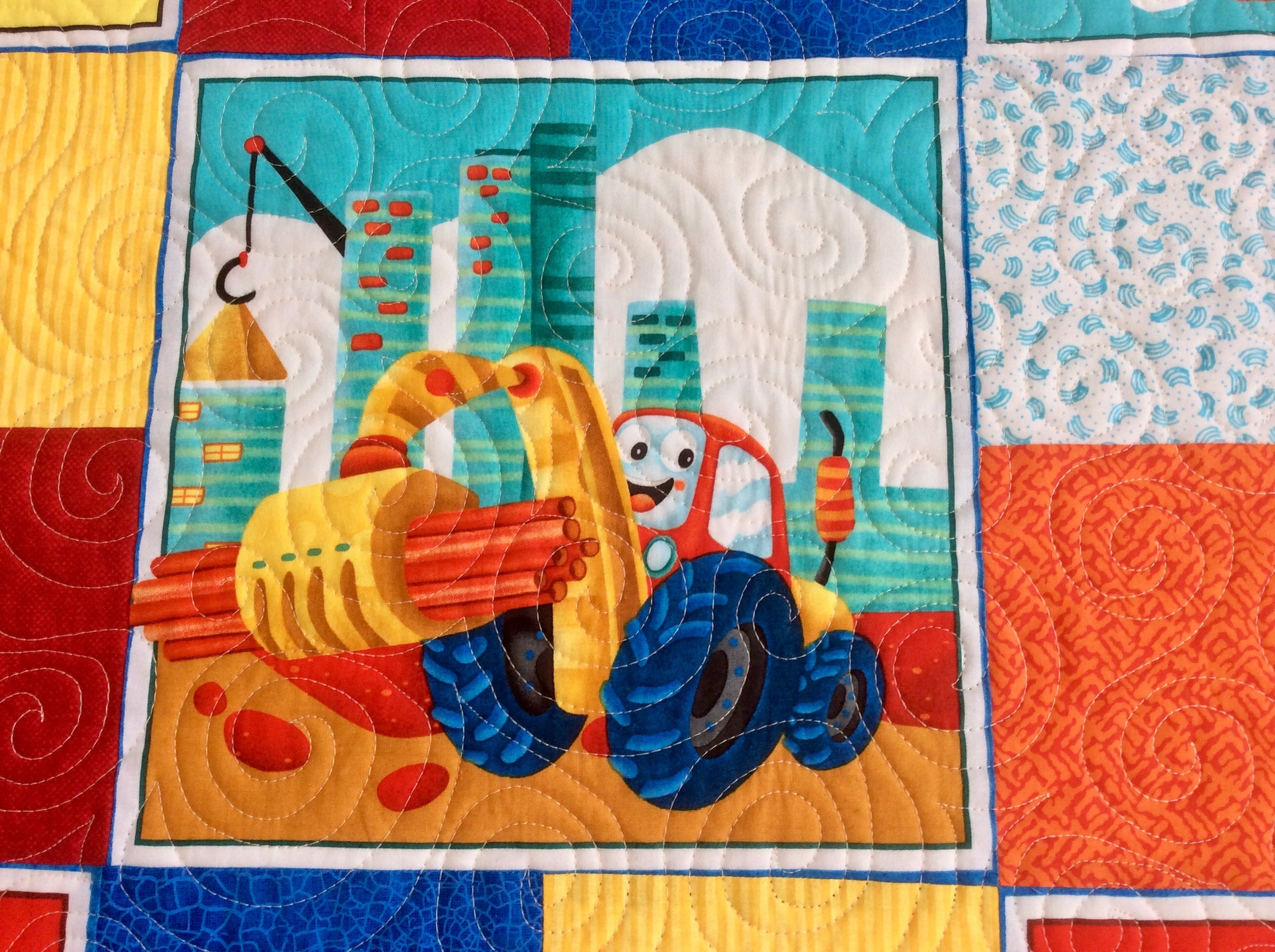 Handmade baby quilt. Happy construction trucks baby quilt.