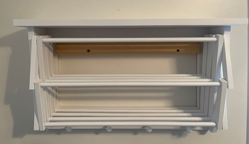 Modern Look White Wall Hanging Drying Rack shown on Unfinished Mount ...