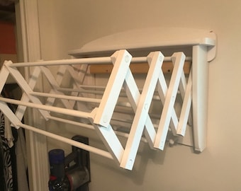 Modern Look White Wall Hanging Drying Rack shown on Unfinished Mount ...