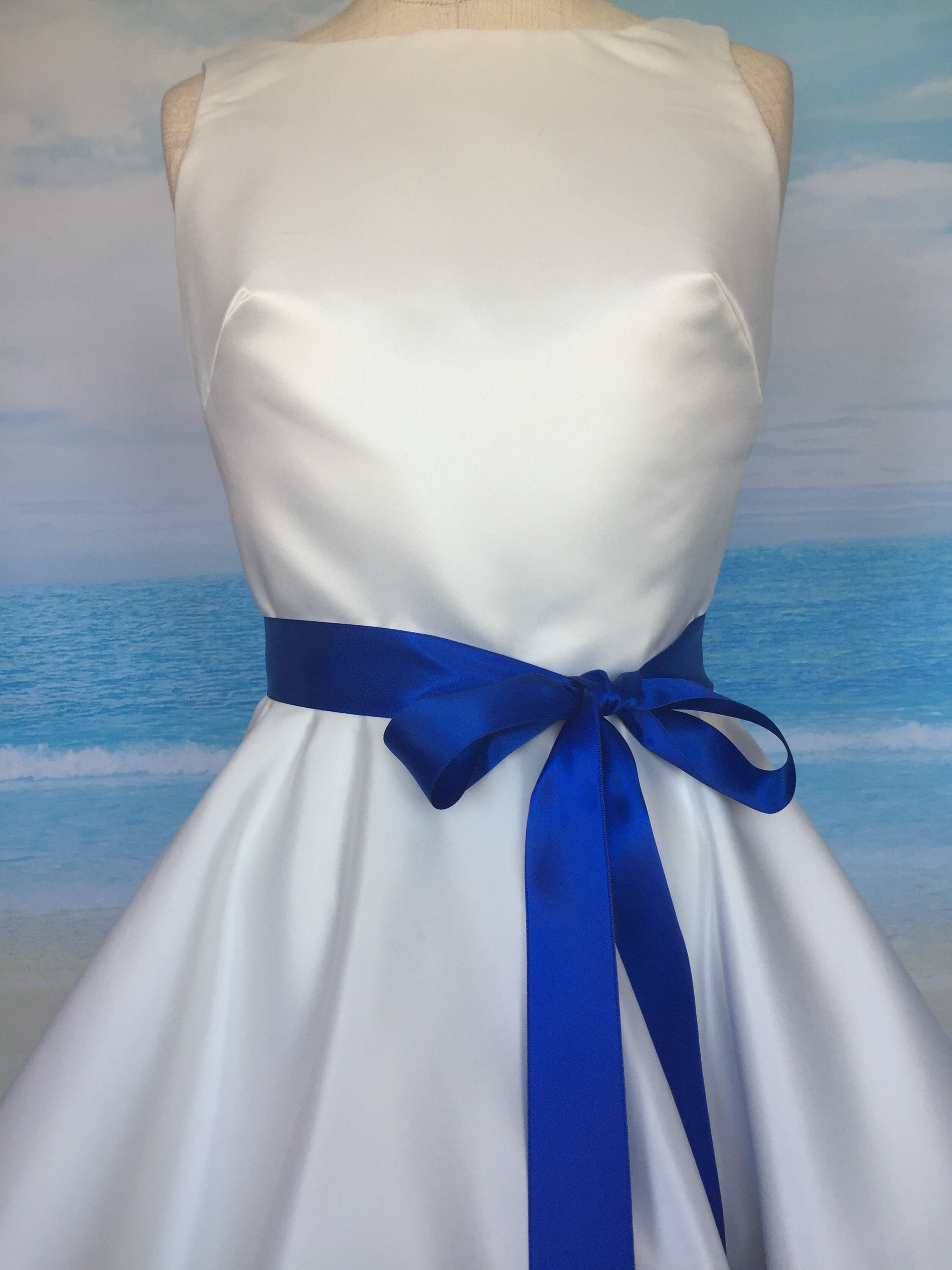 Girls In White Dresses With Blue Satin Sashes