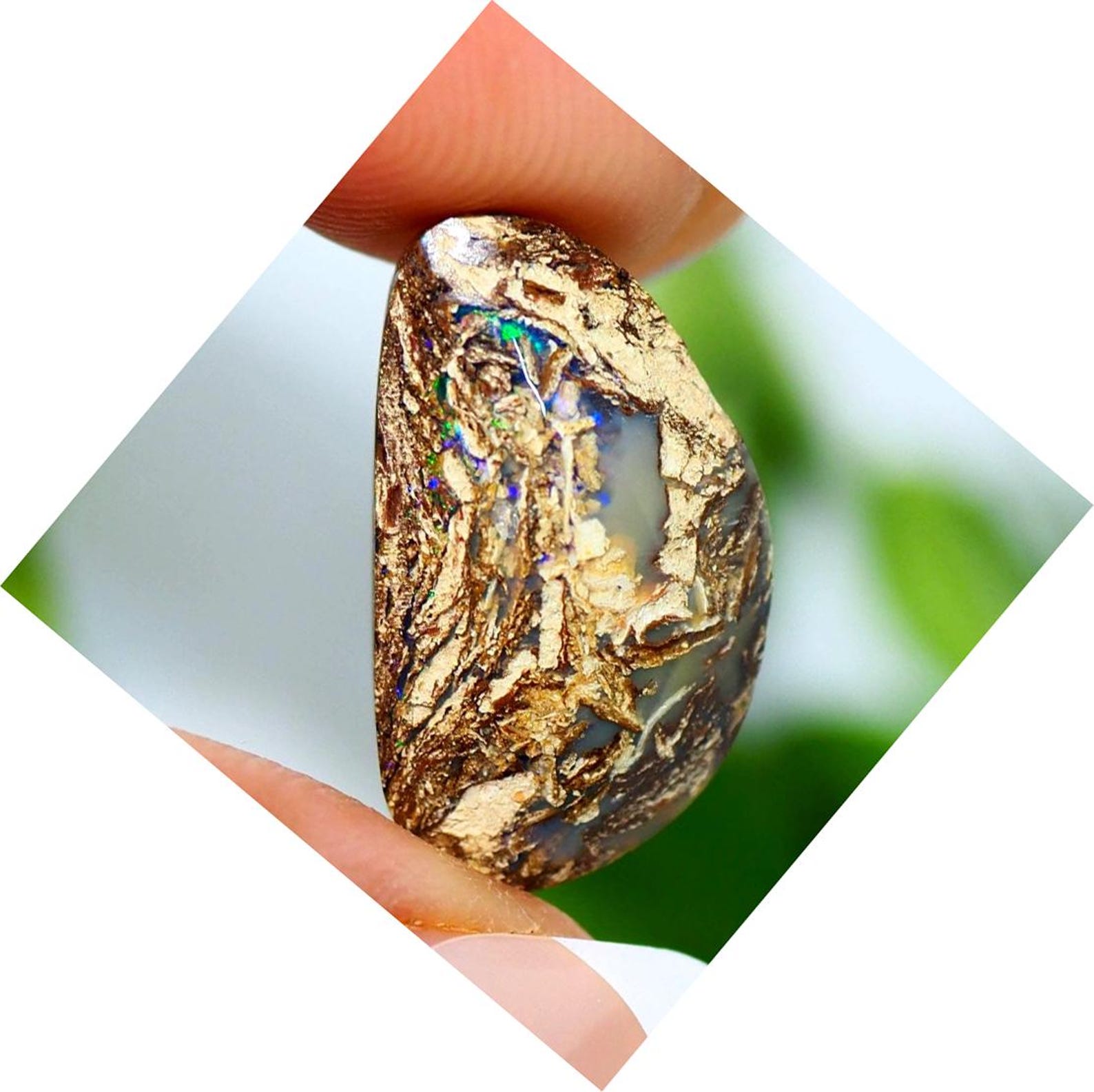 Un hermoso ópalo Boulder con un patrón de cara muy inusual de los ...