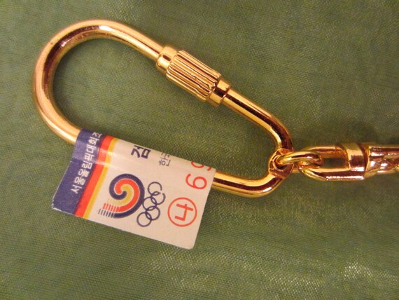 Golden Olympic Commemorative Enameling Key Ring - Gem