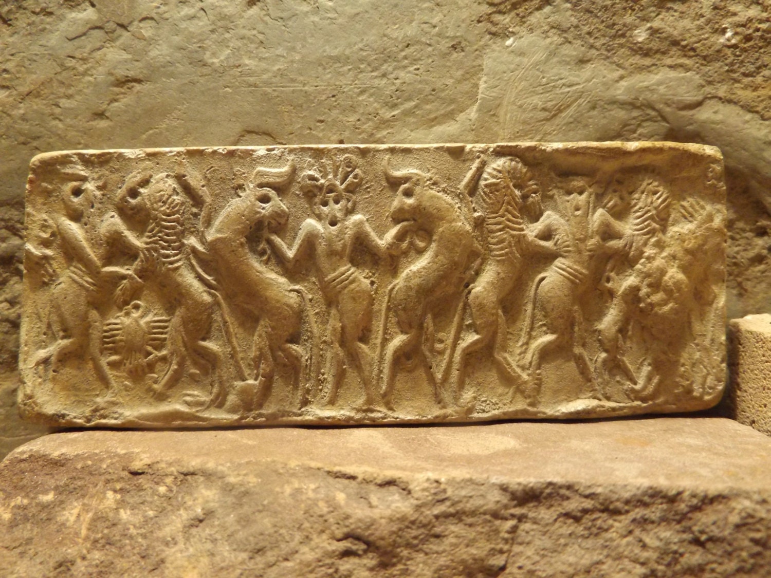 Sumerian cylinder seal impression - Master of animals. Museum replica