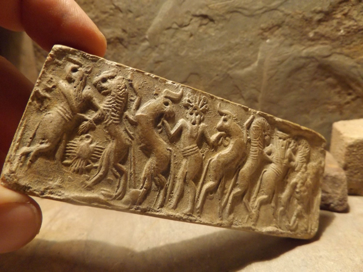 Sumerian cylinder seal impression - Master of animals. Museum replica