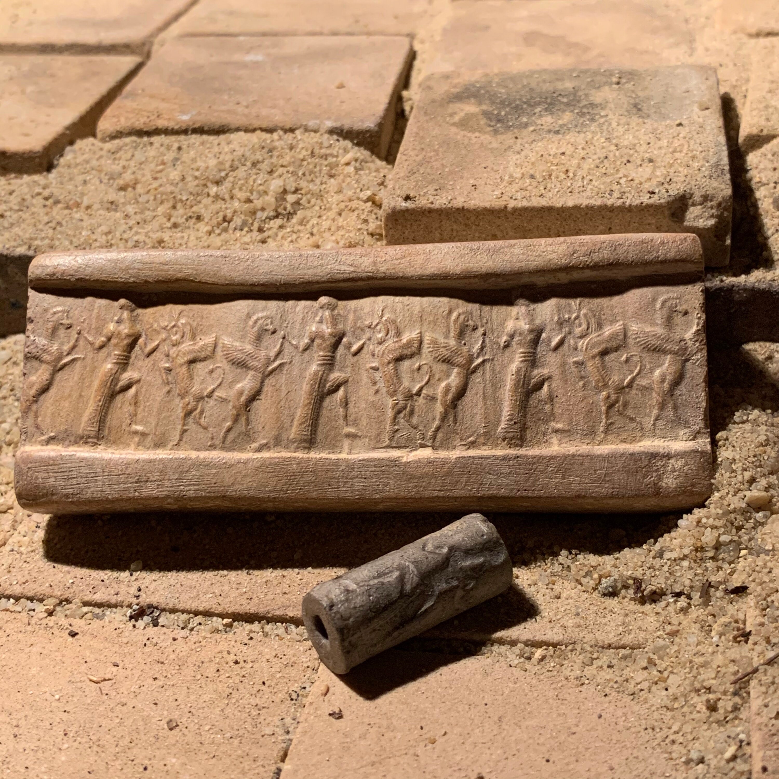 Mesopotamia Assyrian cylinder seal impression - Wrestling winged bull ...