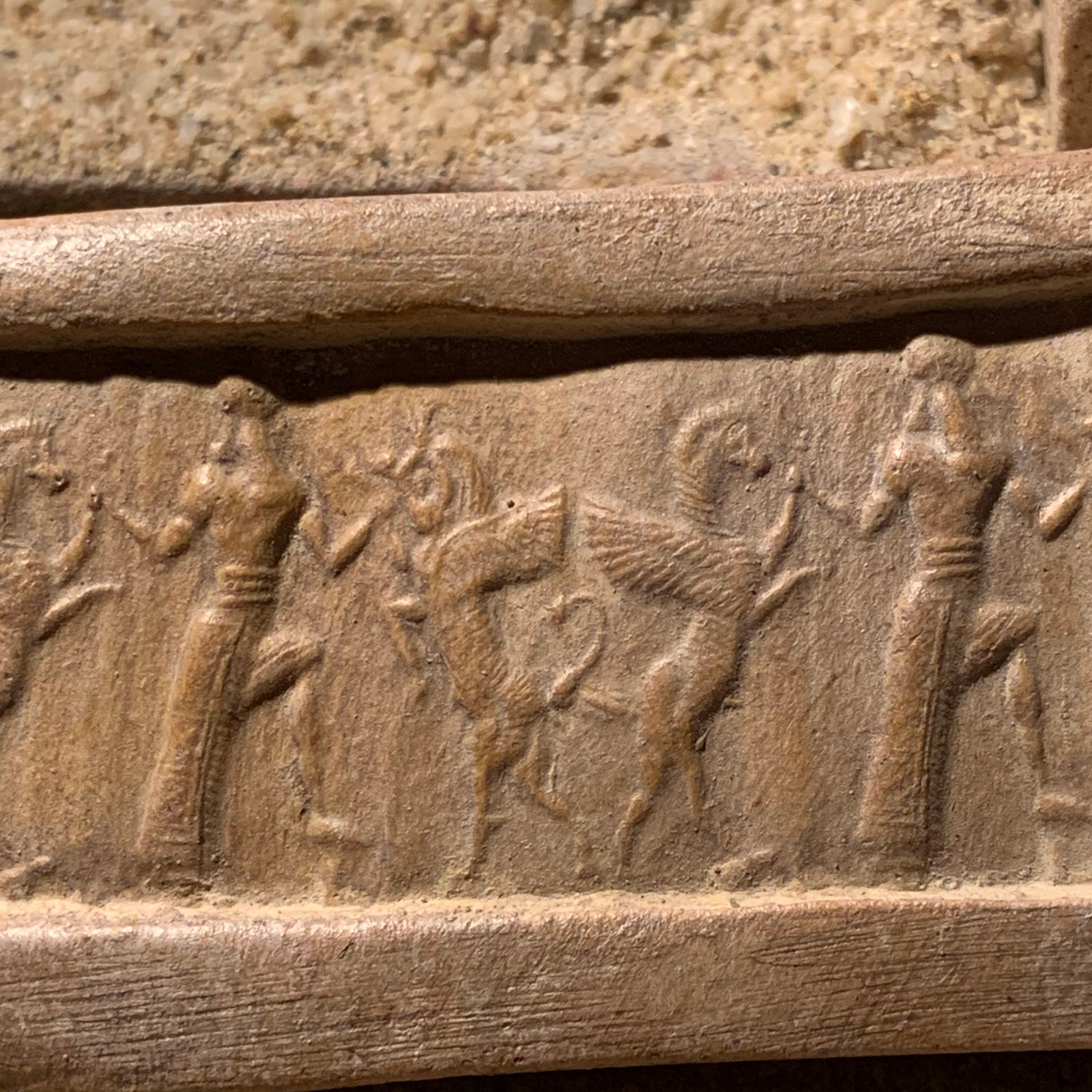 Mesopotamia Assyrian cylinder seal impression - Wrestling winged bull ...