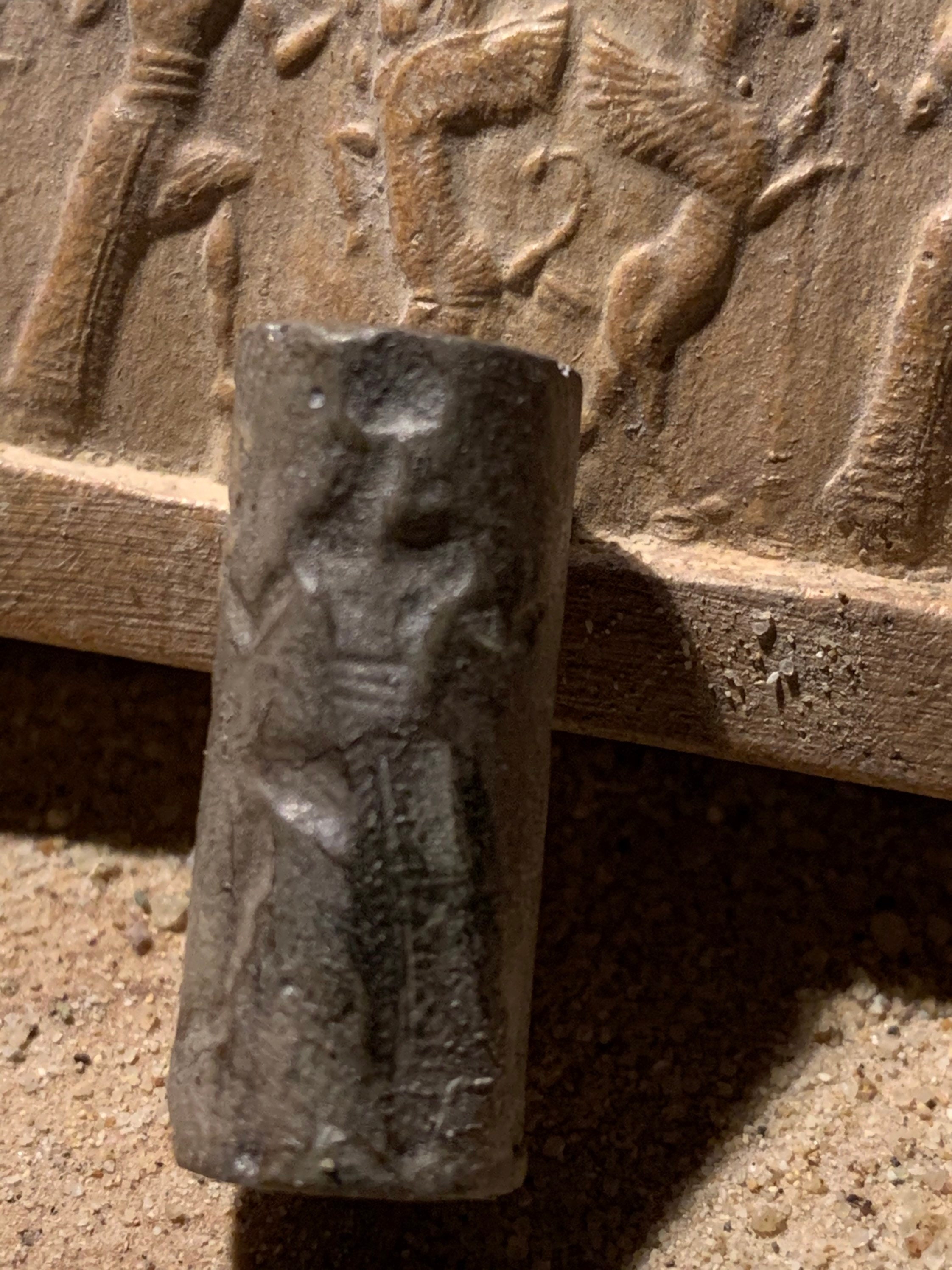 Mesopotamia Assyrian cylinder seal impression - Wrestling winged bull ...