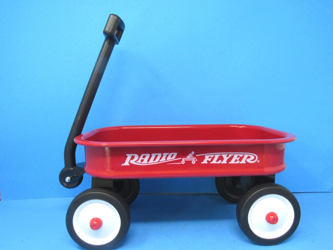This is a Small Radio Flyer Red Wagon With Black Handle and Working ...