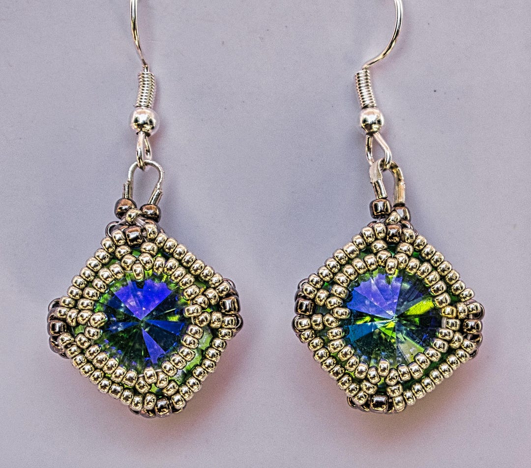 Dangling Color Shift Peridot Rivoli Earrings Surrounded by Silver and ...