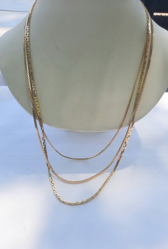 long strand gold tone - Gem