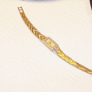 Beautiful 14 Kt Solid Gold and Diamond Cristian Geneve Quartz Ladies With Chevron Pattern Band ...