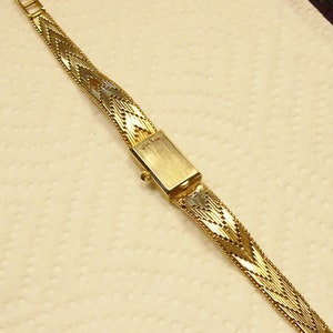 Beautiful 14 Kt Solid Gold and Diamond Cristian Geneve Quartz Ladies With Chevron Pattern Band ...