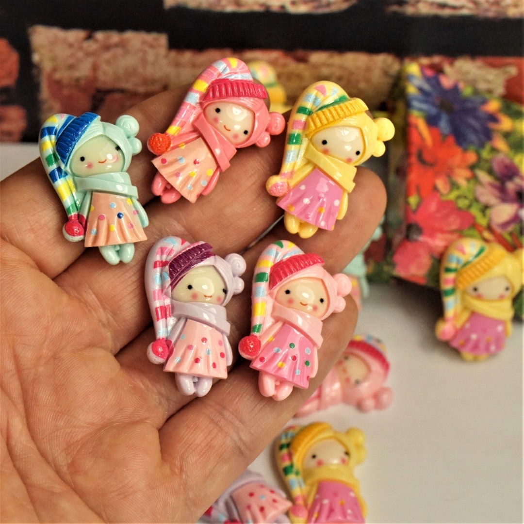 Small Figurines of Girls Wearing Winter Hats and Dresses - Flatback ...